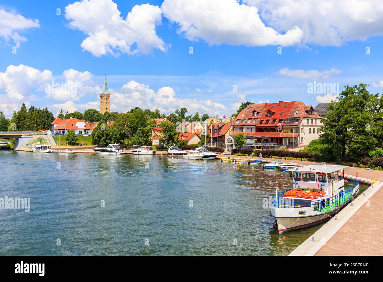 Tourist ship in Mikolajki port on sunny summer day, Mazury Lake ...