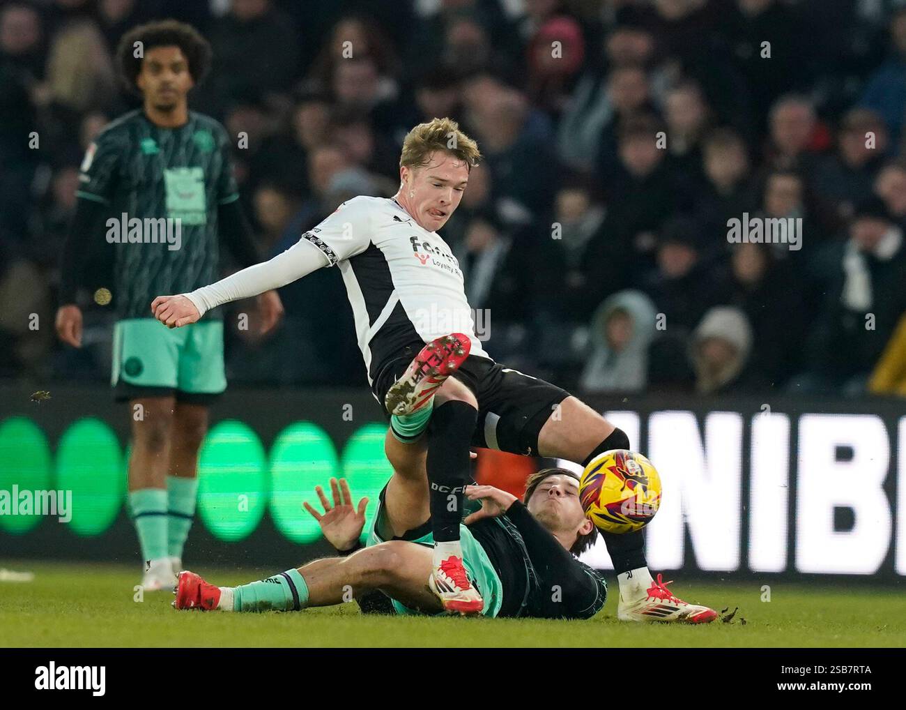 Derby, UK. 1st Feb, 2025. Sydie Peck of Sheffield United tussles with ...