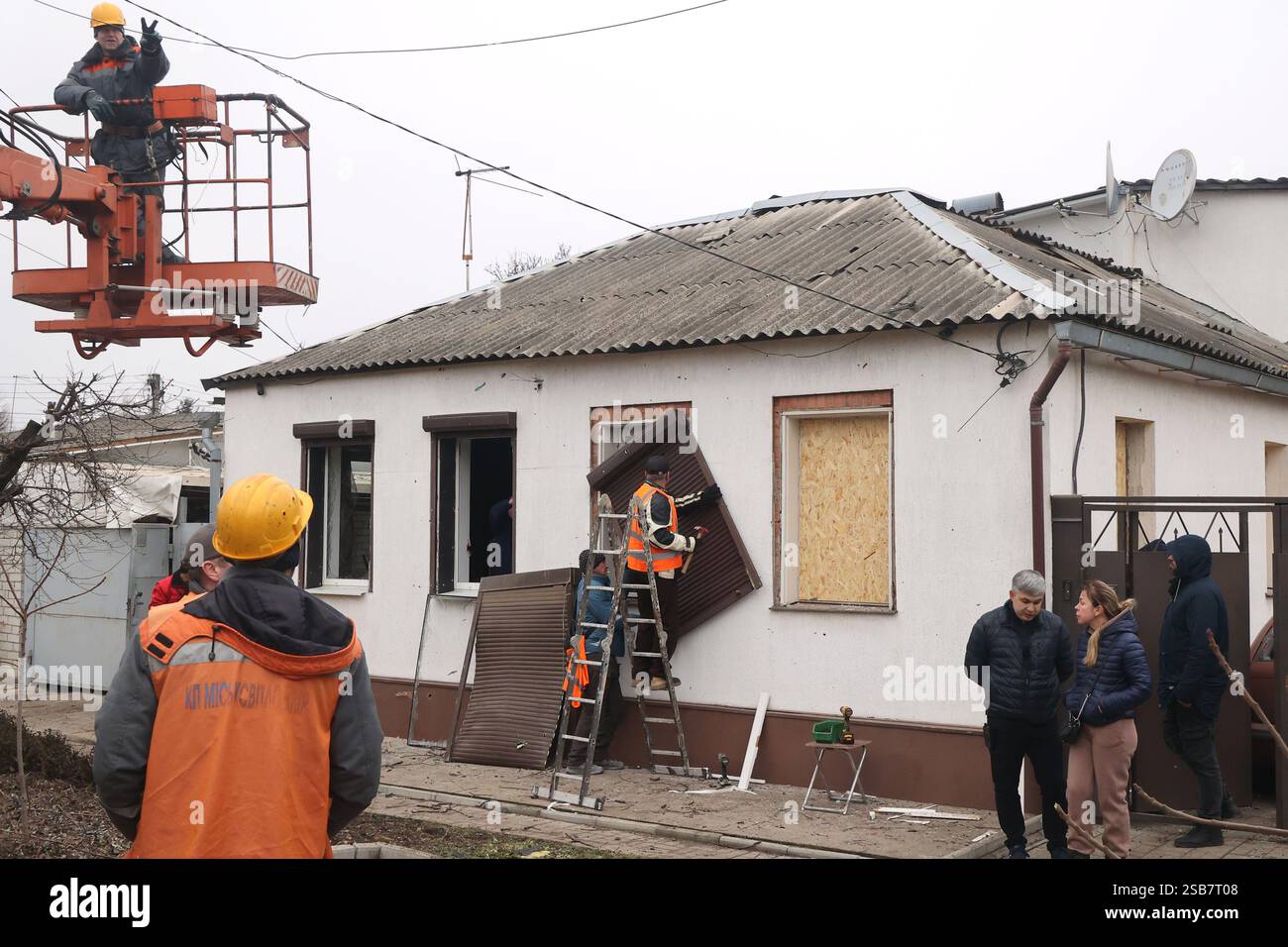 KHARKIV, UKRAINE - FEBRUARY 1, 2025 - Municipal workers replace broken ...