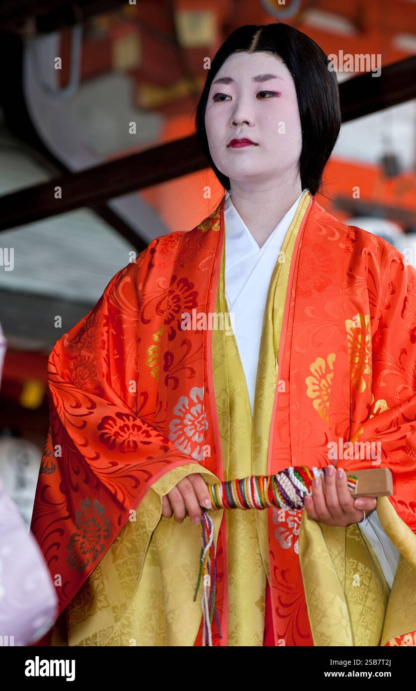 Females dressed in colorful kimono as aristocrats from the Heian Period ...