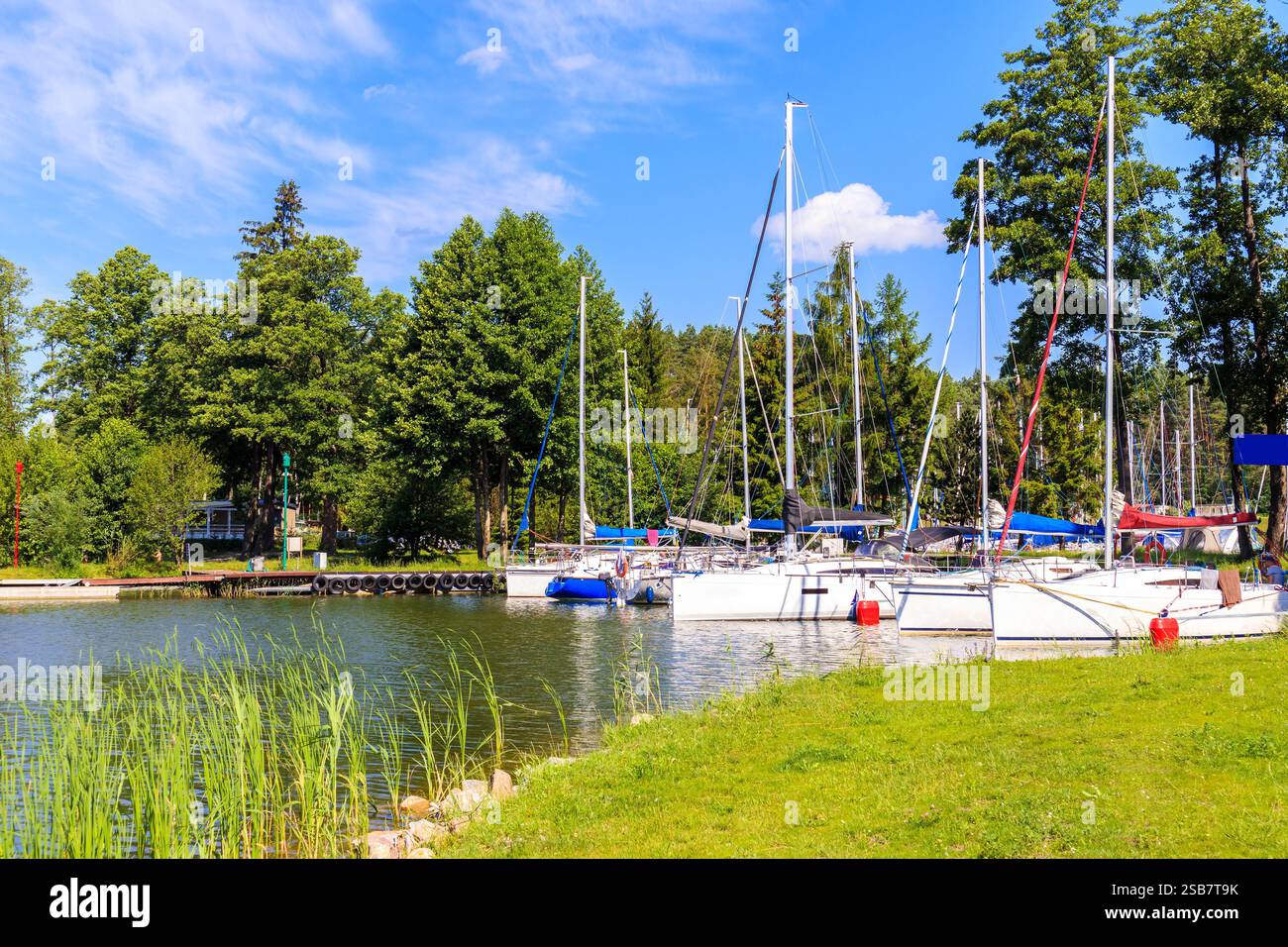 Catamaran sailing boats on lake Beldany in Piaski port on summer sunny ...