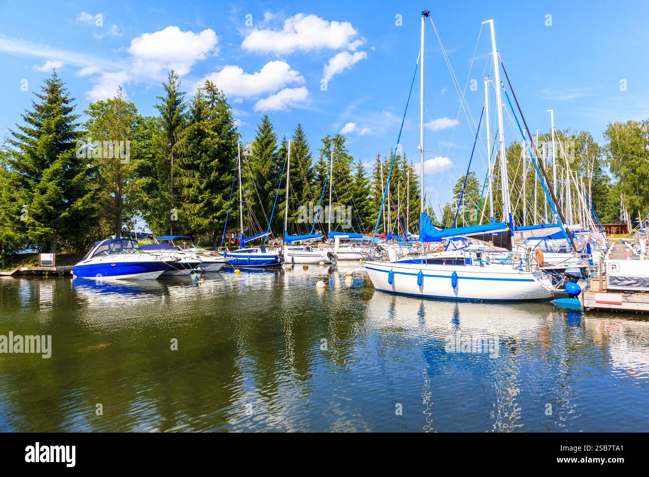 Sailing boats on lake Beldany in Piaski port on summer sunny day ...