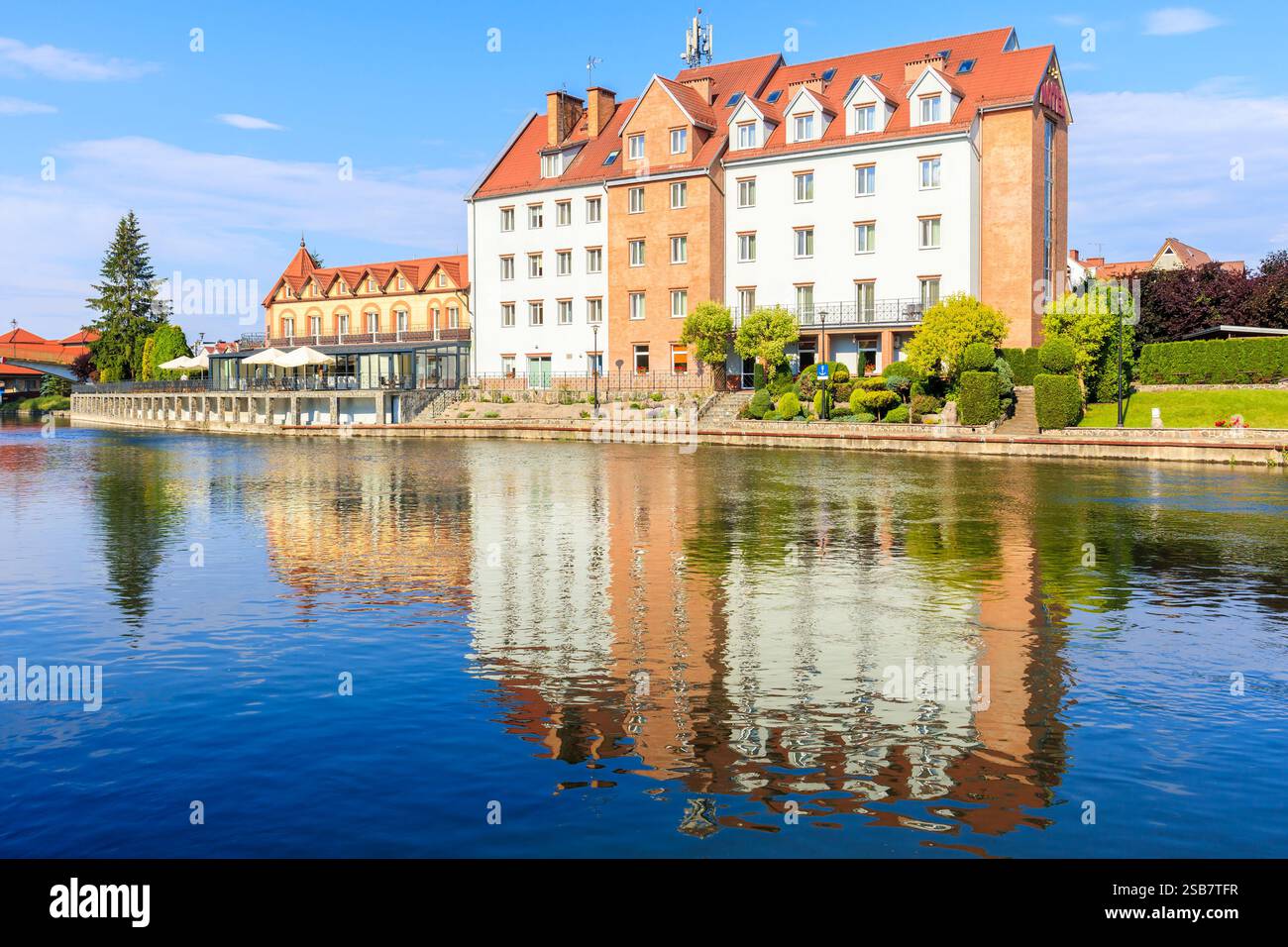 Reflection of historic buildings in Pisa river in Pisz town, Masurian ...