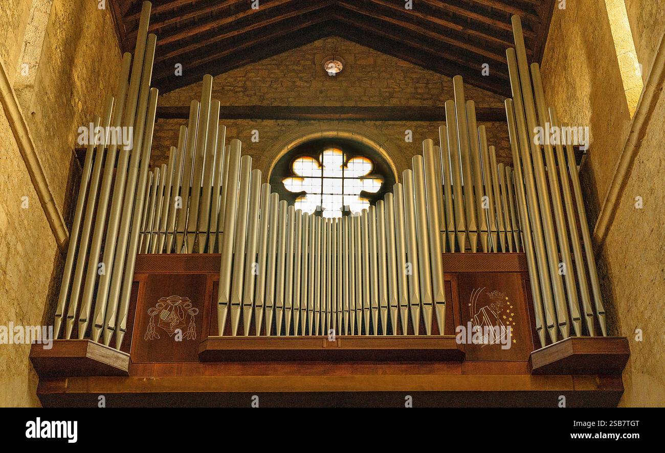 inside an old medieval church the elegant structure of the pipes of an ...