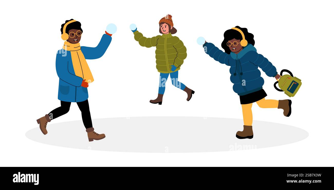 Children enjoying a snowy day outside while making snowballs during ...