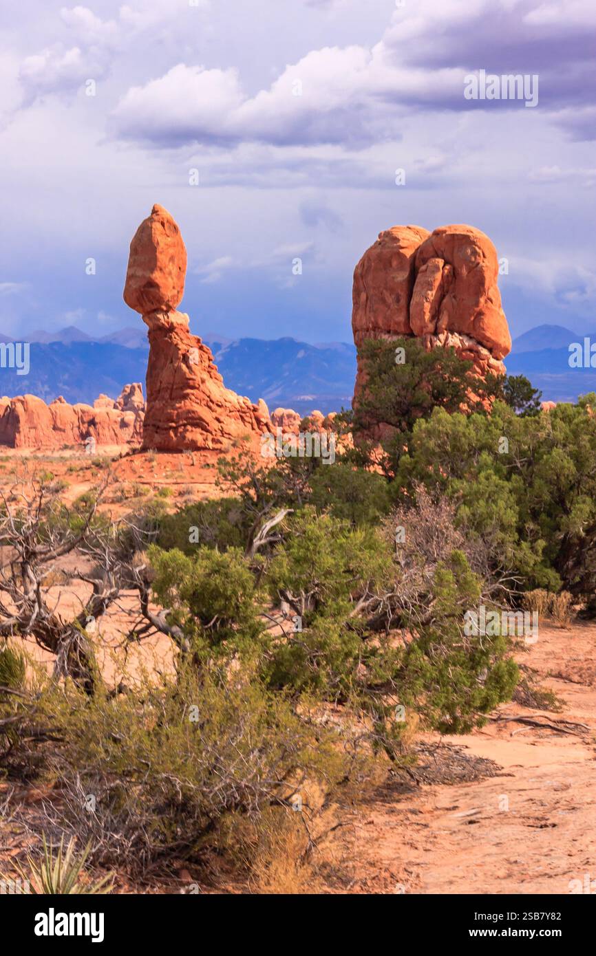 A mountain range with a rock formation that looks like a half-circle ...