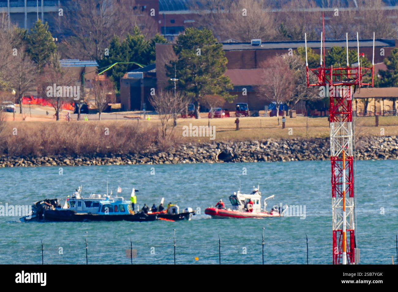Emergency response units continue to search the crash site of an ...