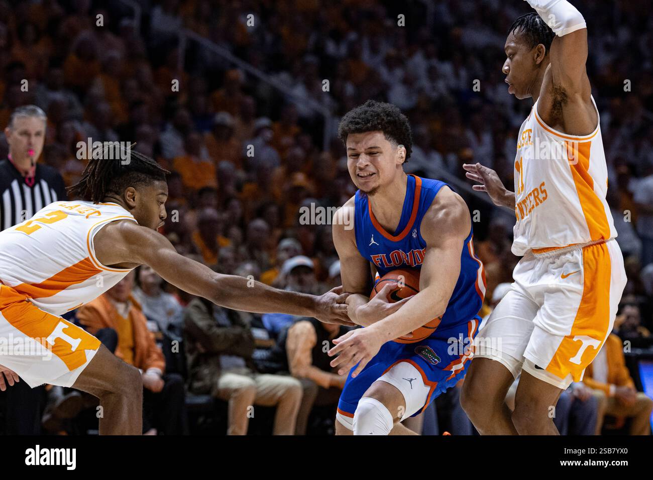 Florida guard Walter Clayton Jr. (1) tries to drive between Tennessee ...