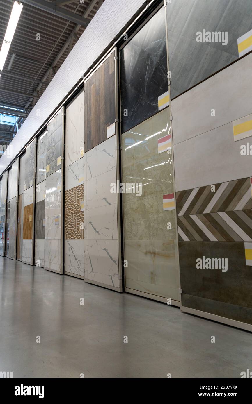 Modern store interior. Bathroom tiles and utensils shopping. Displays ...