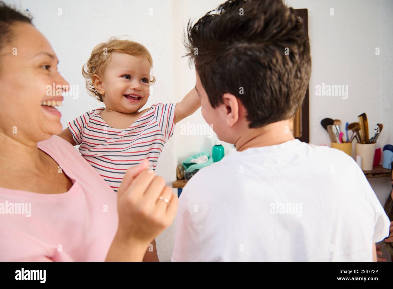 Cheerful interaction within a family setting, showcasing happiness ...
