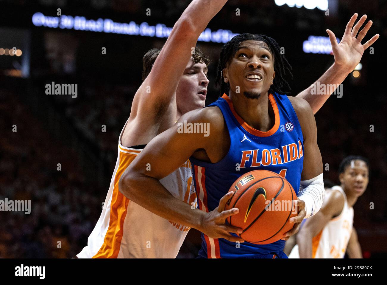 Florida forward Sam Alexis (4) works for a shot against Tennessee ...