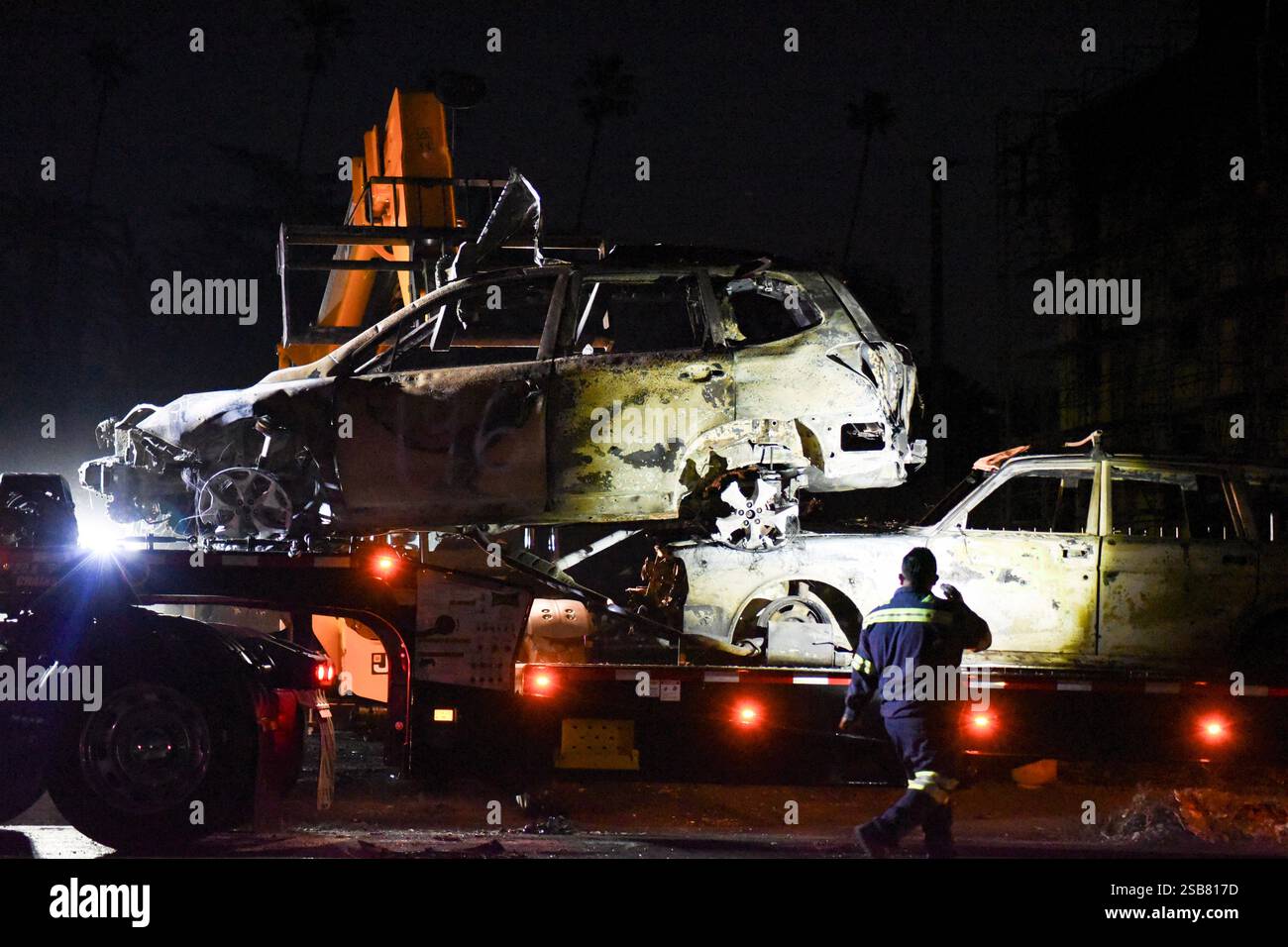 Altadena, Califronia, USA. 18th Jan, 2025. Burned Cars are removed at ...