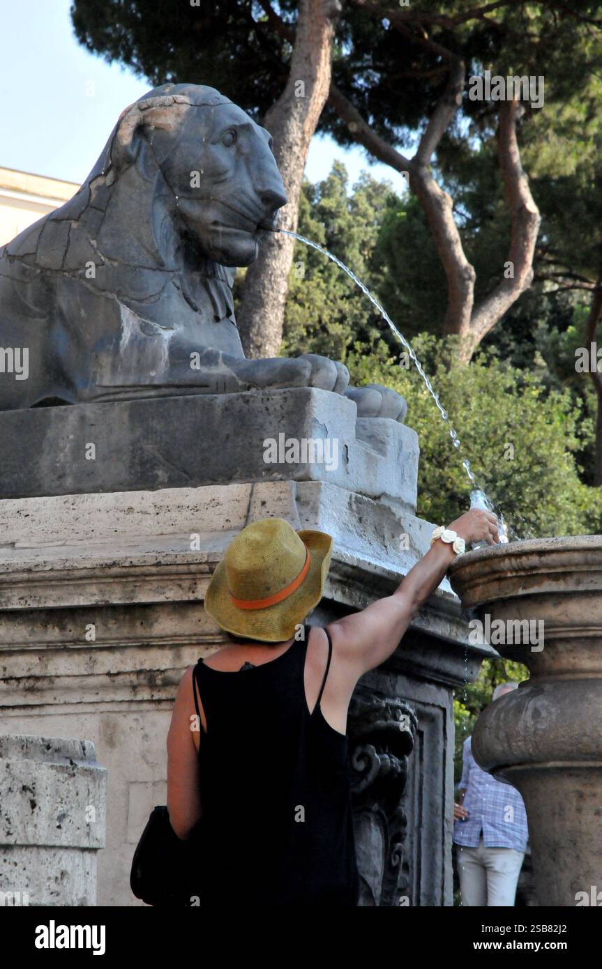 Rome / Italy 18.July 2019/ Tourists fellling up empty bottle with ...