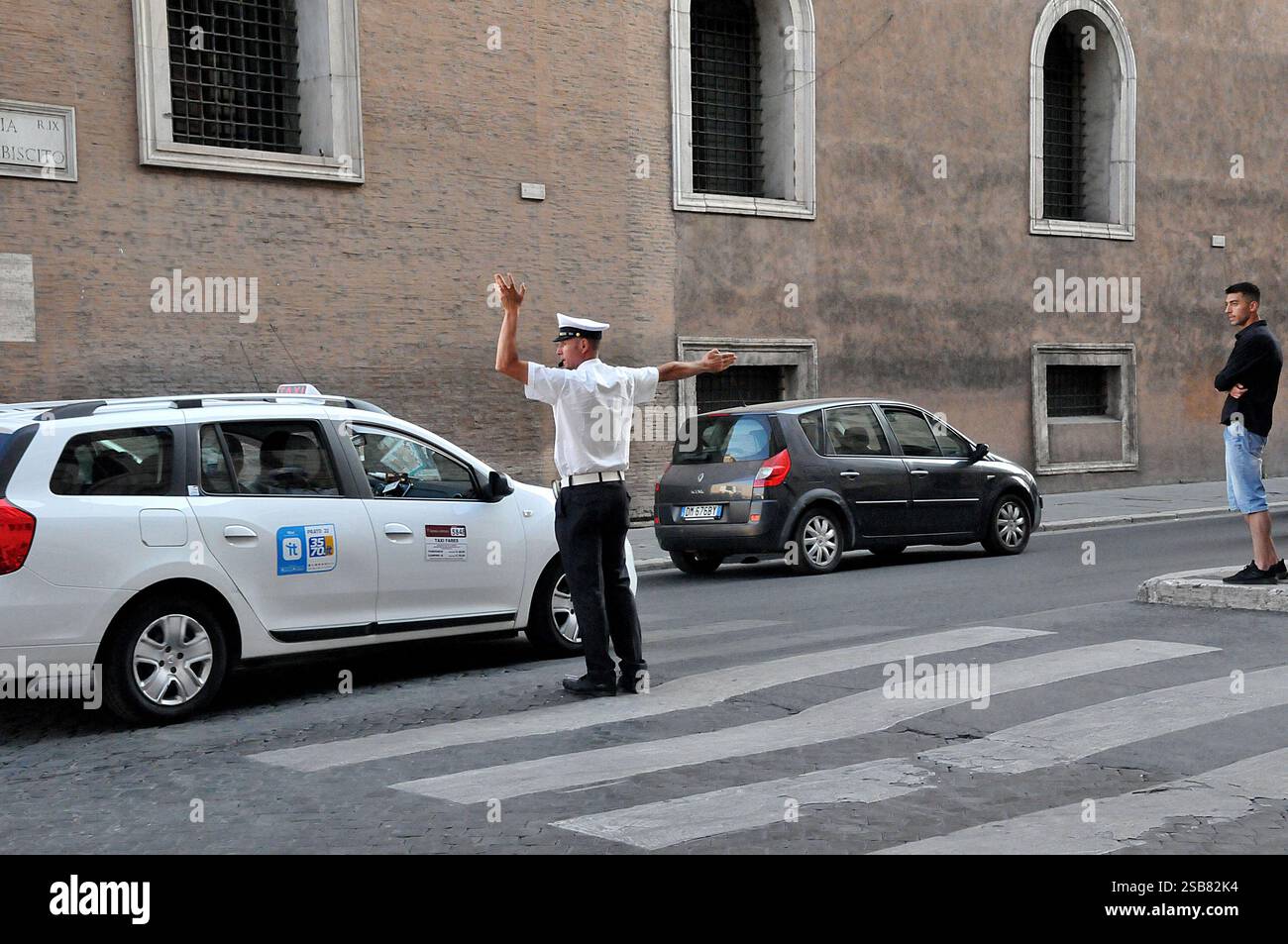 Rome / Italy 18.July 2019/ Police officer instructing traffic choas at ...