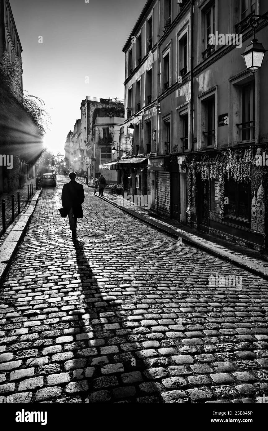 FRANCE. PARIS (75) 18TH DISTRICT. A MAN WALKS DOWN RUE GABRIELLE IN ...