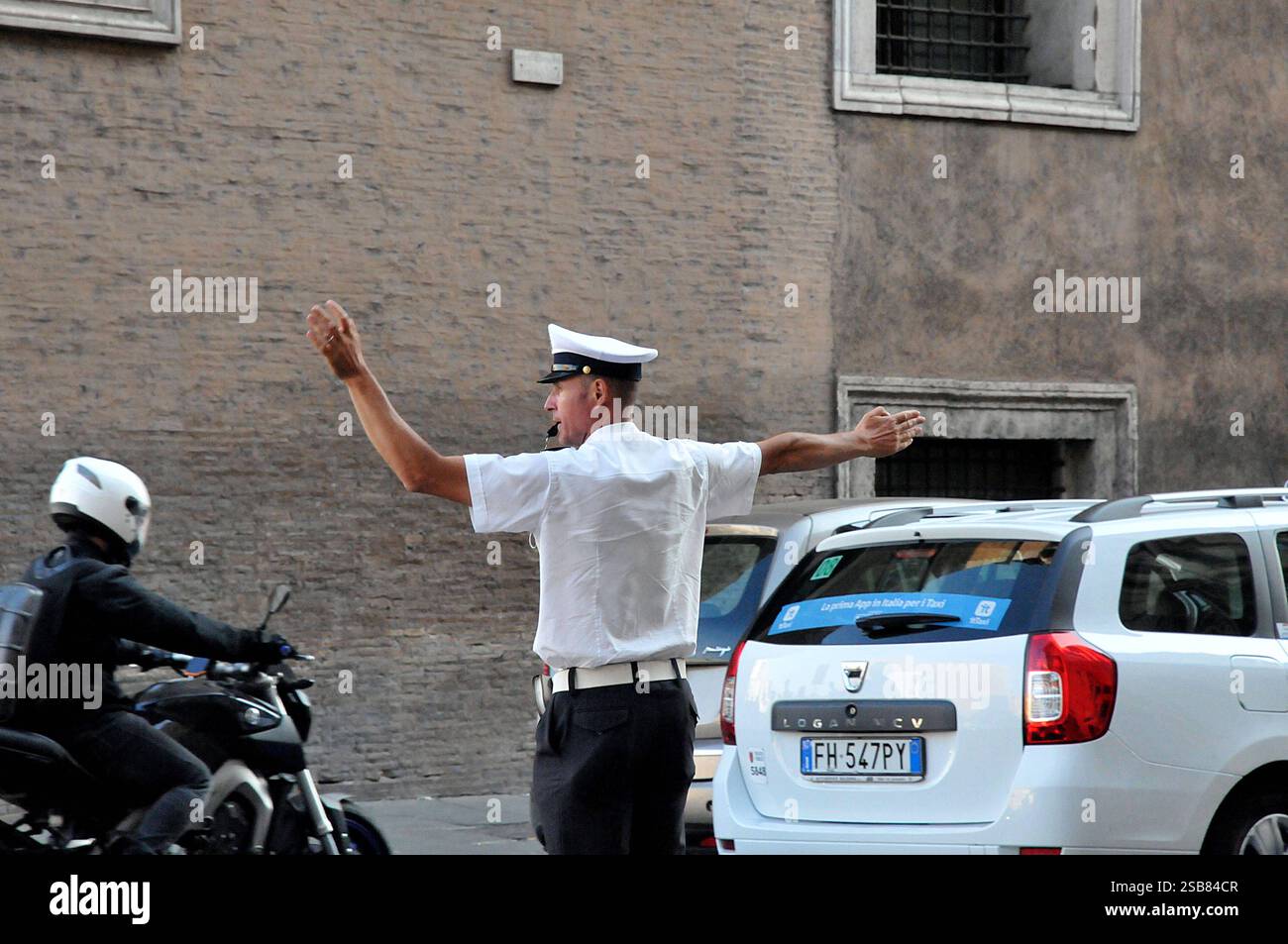 Rome / Italy 18.July 2019/ Police officer instructing traffic choas at ...