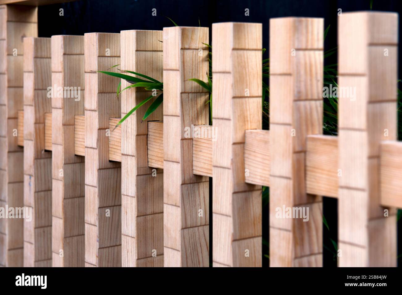 Architectural detail of new hand-hewed fence showing Japanese tsugite ...