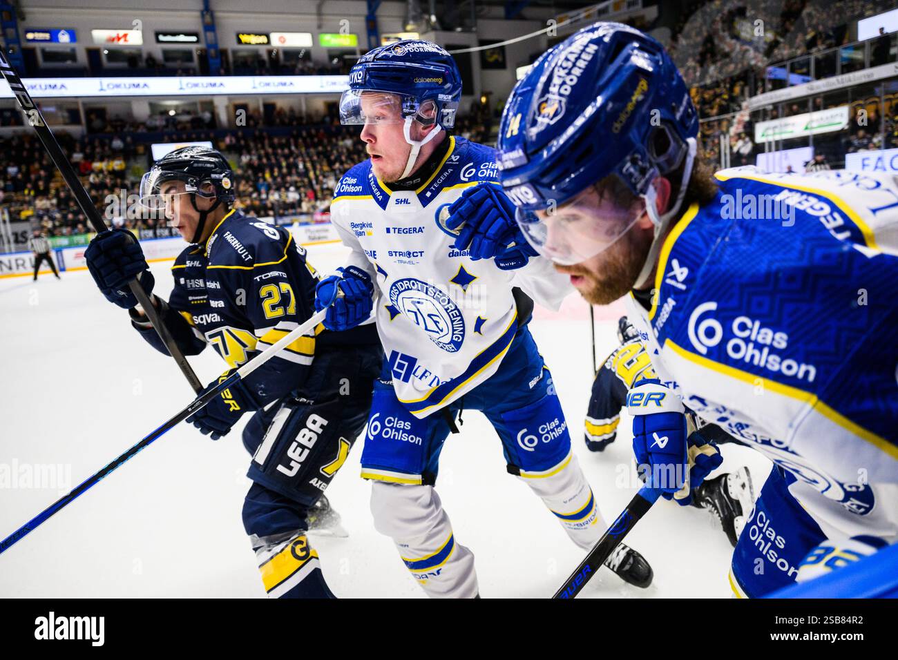 250201 HV71s Jonathan Ang och Leksands Kalle Östman, Oskar Lang under ishockeymatchen i SHL ...