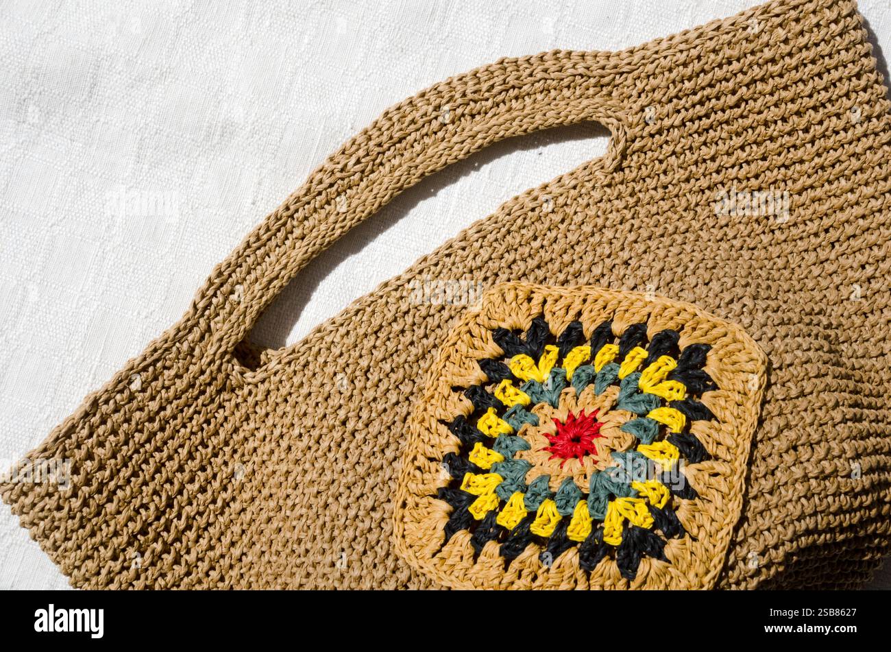 Eco-friendly raffia bag. Beautiful handmade crocheted beach bag Stock ...