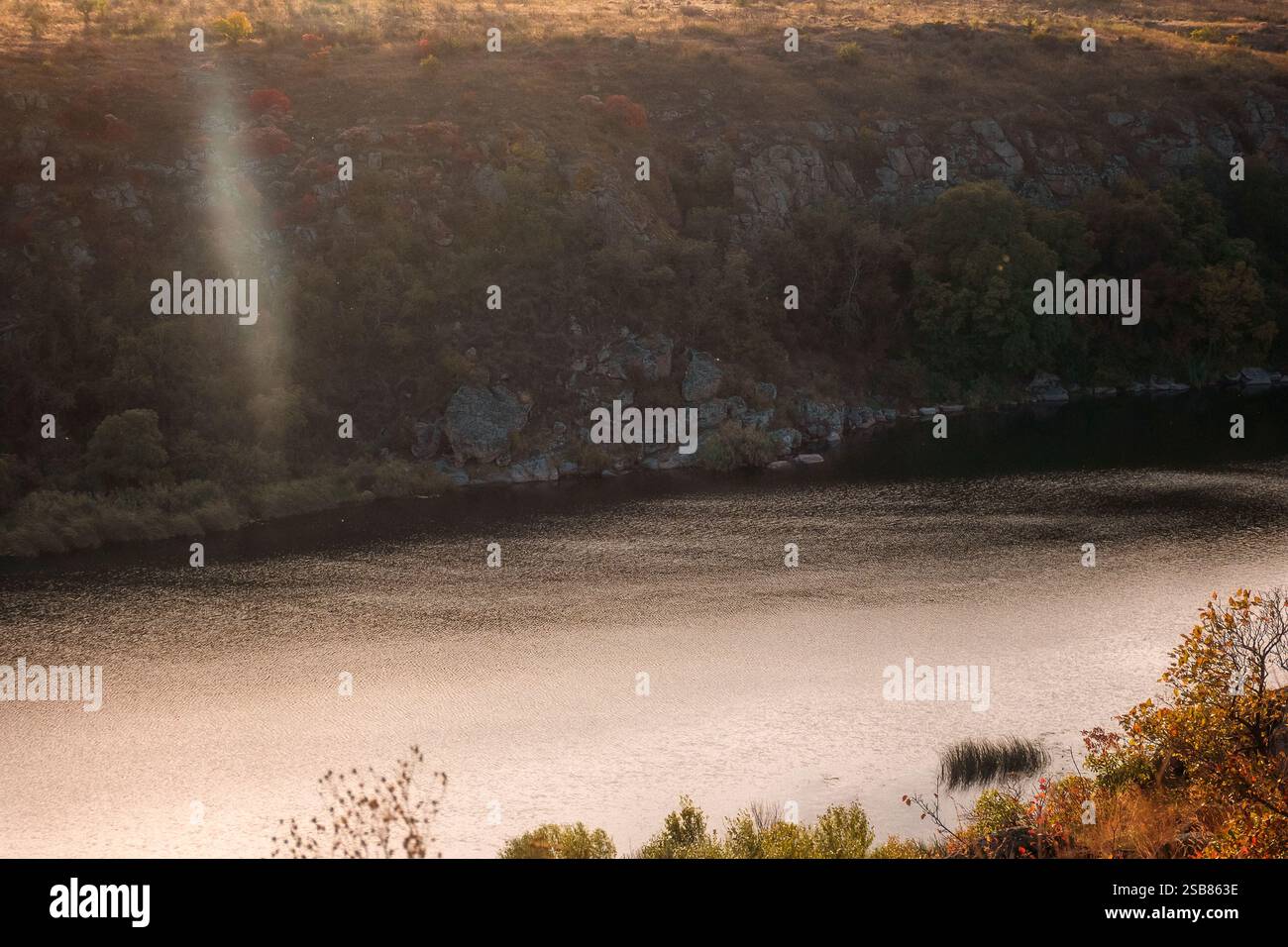 a huge wide river flows among steep banks Stock Photo - Alamy