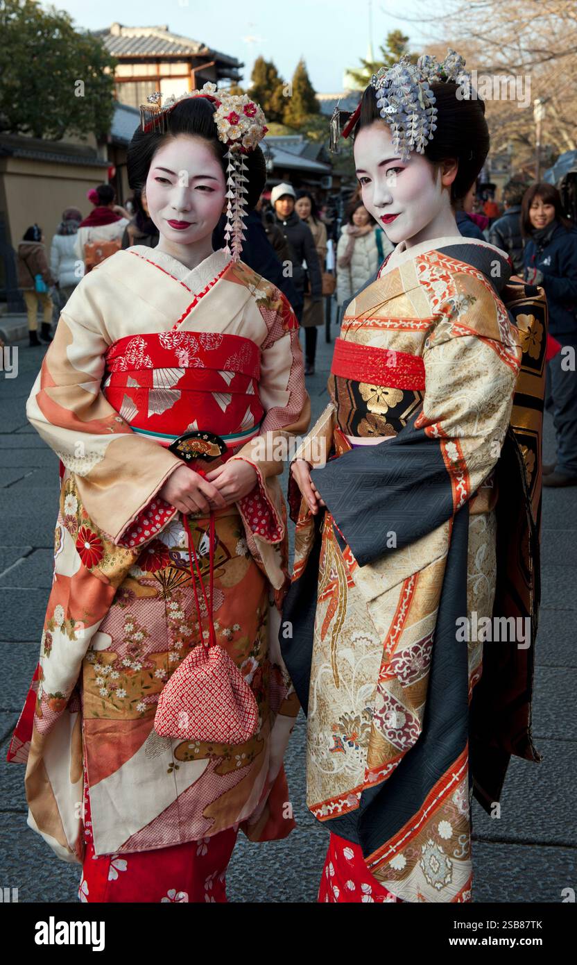 Two female tourists dressed up like maiko (apprentice geisha) walking ...