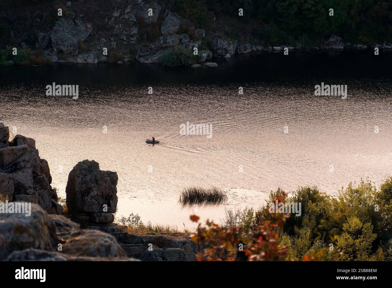 A huge wide river flows between steep banks Stock Photo - Alamy