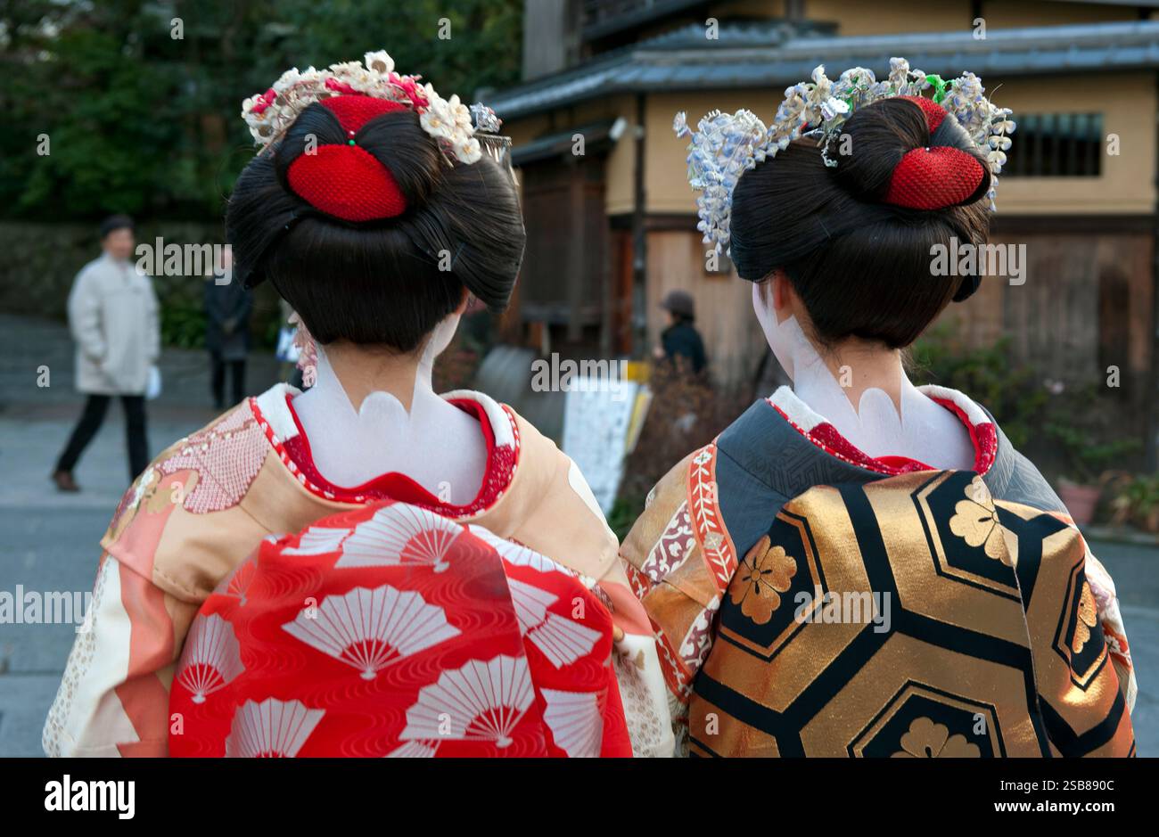 Two female tourists dressed up like maiko (apprentice geisha) walking the streets of Higashiyama ...