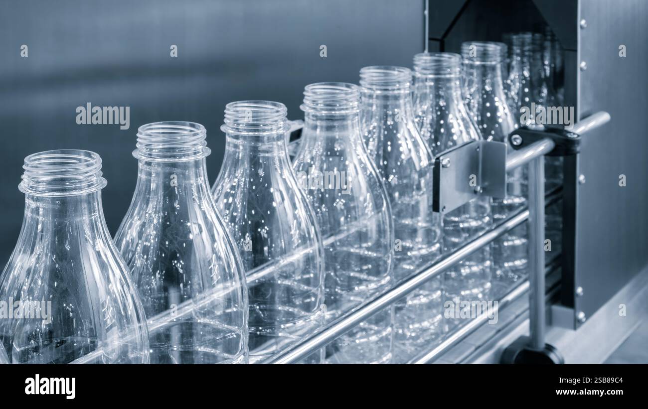 Bottle. Industrial production of plastic pet bottles. Factory line for manufacturing ...