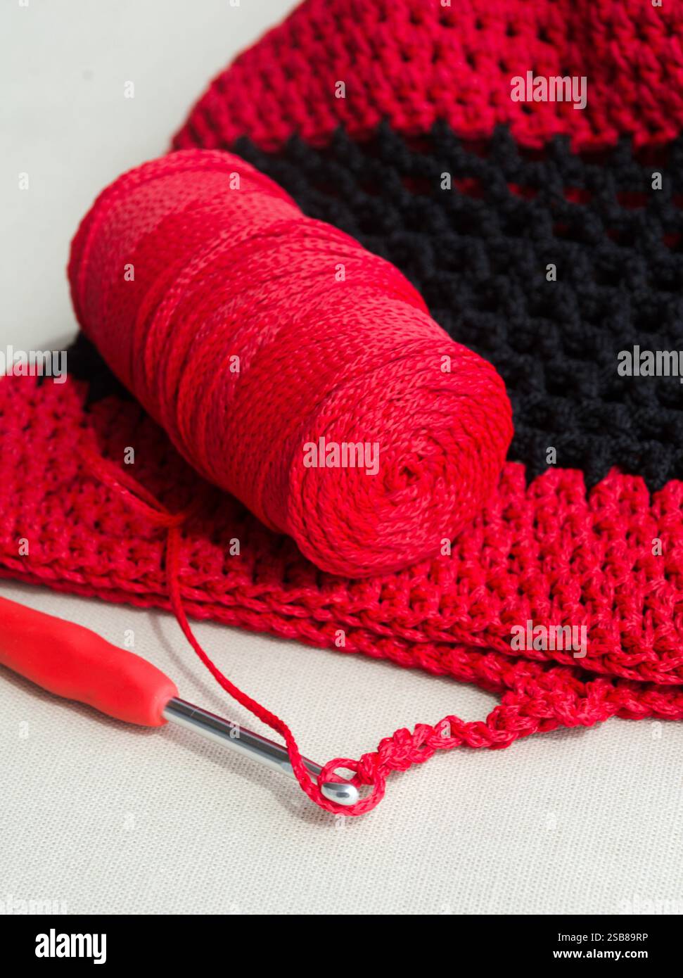 Crochet texture. Red and black polyester crocheted cords. Cord for ...