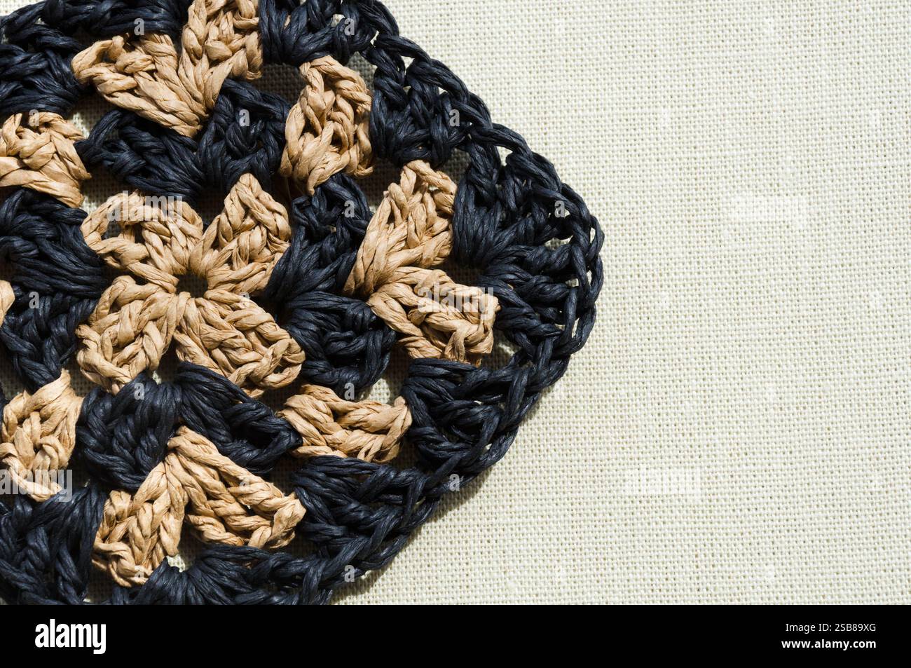 Raffia granny square. Raffia knitting texture close-up on burlap ...