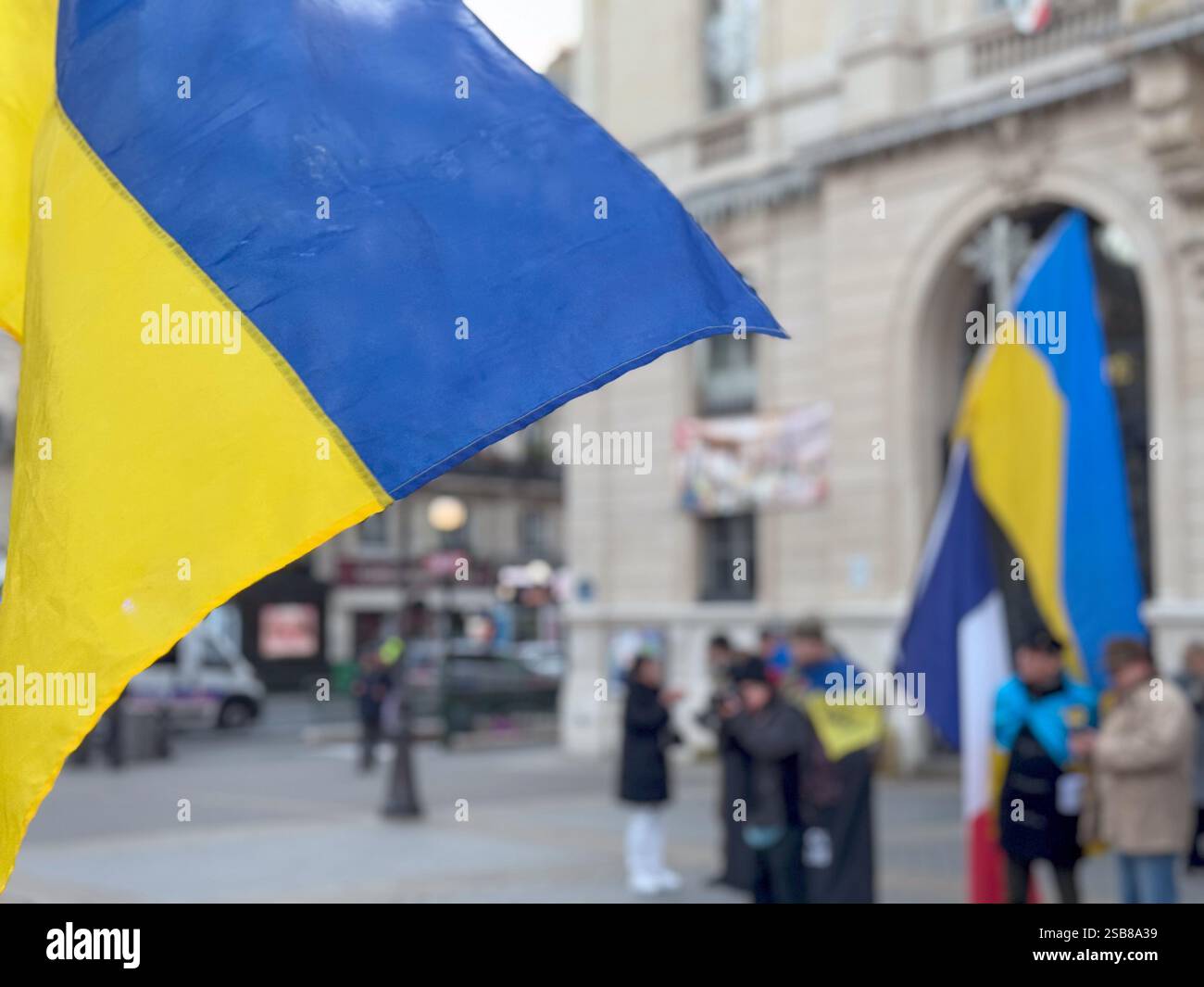 Colorful flags flutter at a lively gathering in the city center Stock ...