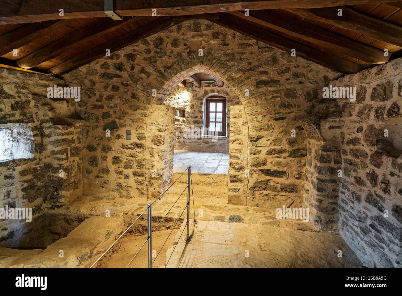 A historic stone room inside Andromonastiro Monastery in Messinia ...