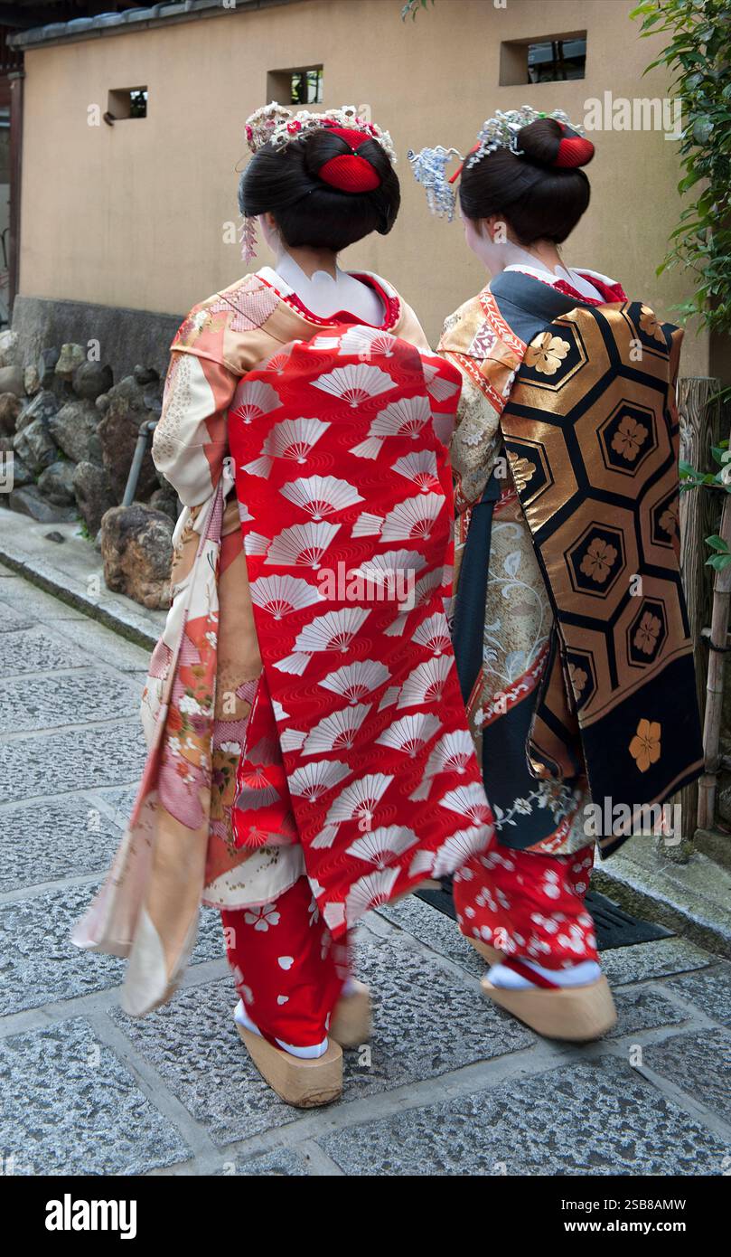 Two female tourists dressed up like maiko (apprentice geisha) walking ...