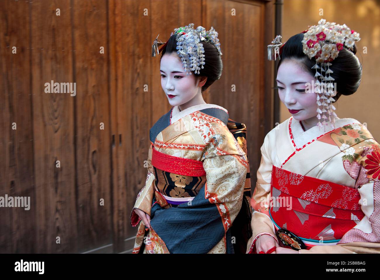 Two female tourists dressed up like maiko (apprentice geisha) walking ...
