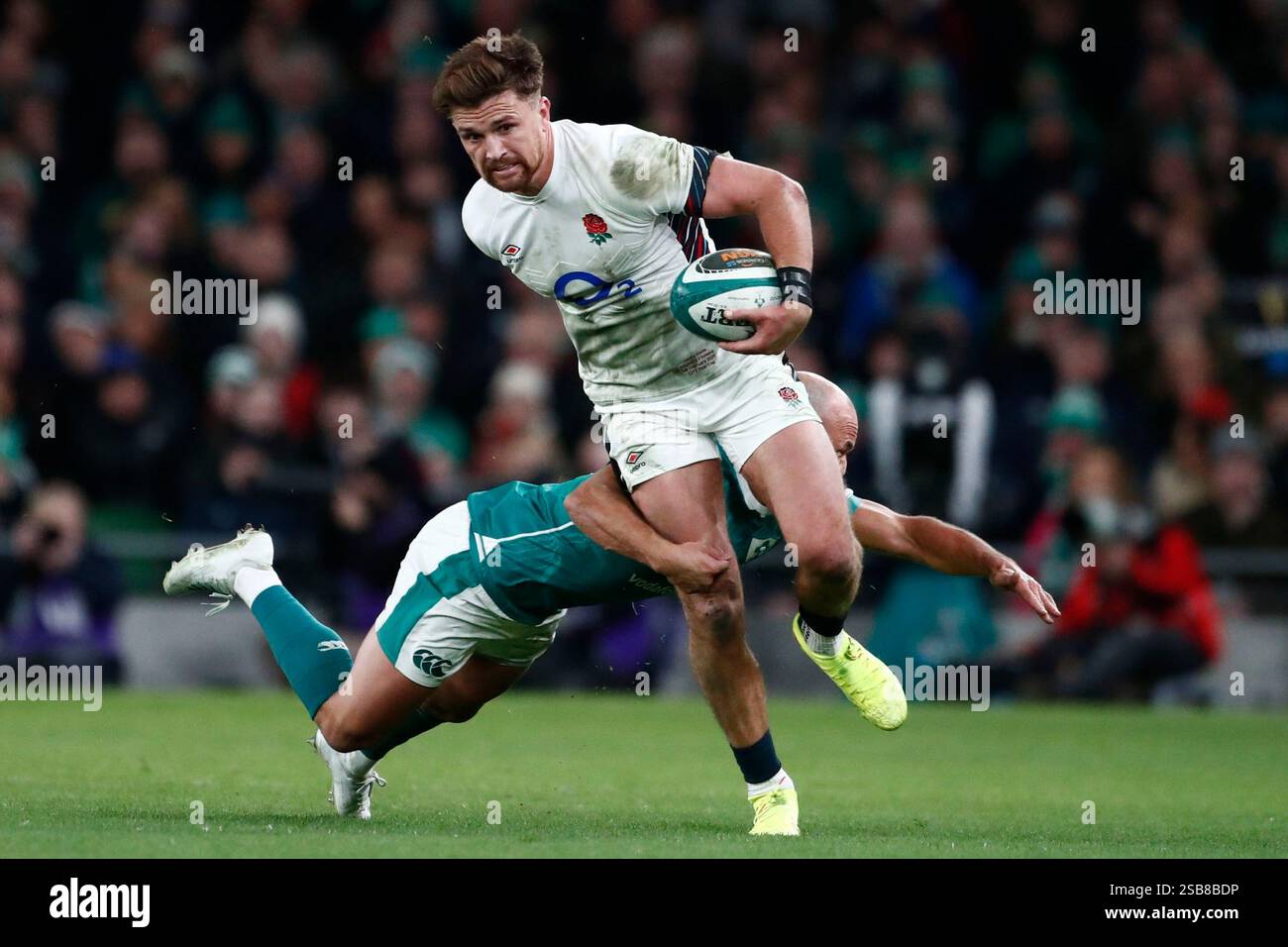 England's Henry Slade is tackled by Ireland's Jamison Gibson-Park ...