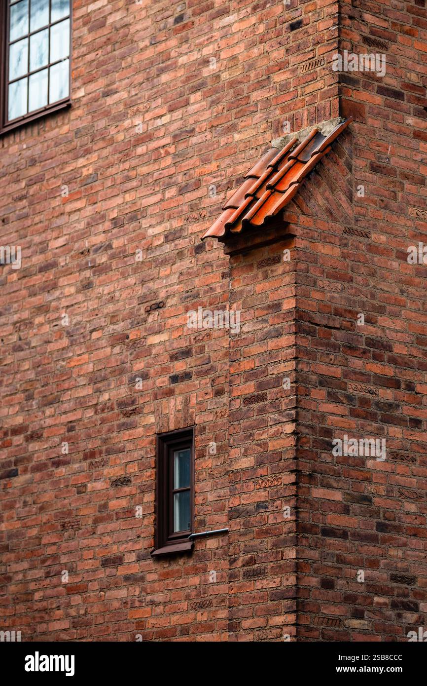 brick building with two windows and small roof structure Stock Photo ...