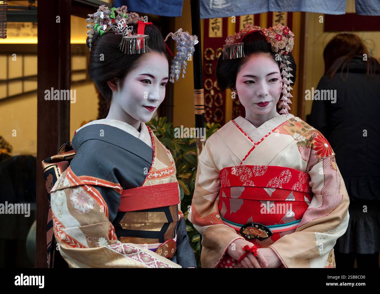 Two female tourists dressed up like maiko (apprentice geisha) walking ...