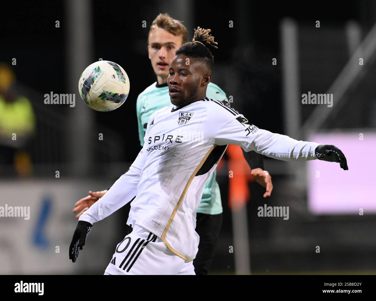 Eupen, Belgium. 01st Feb, 2025. Eupen's Ade Oguns and Lommel's Jesper ...