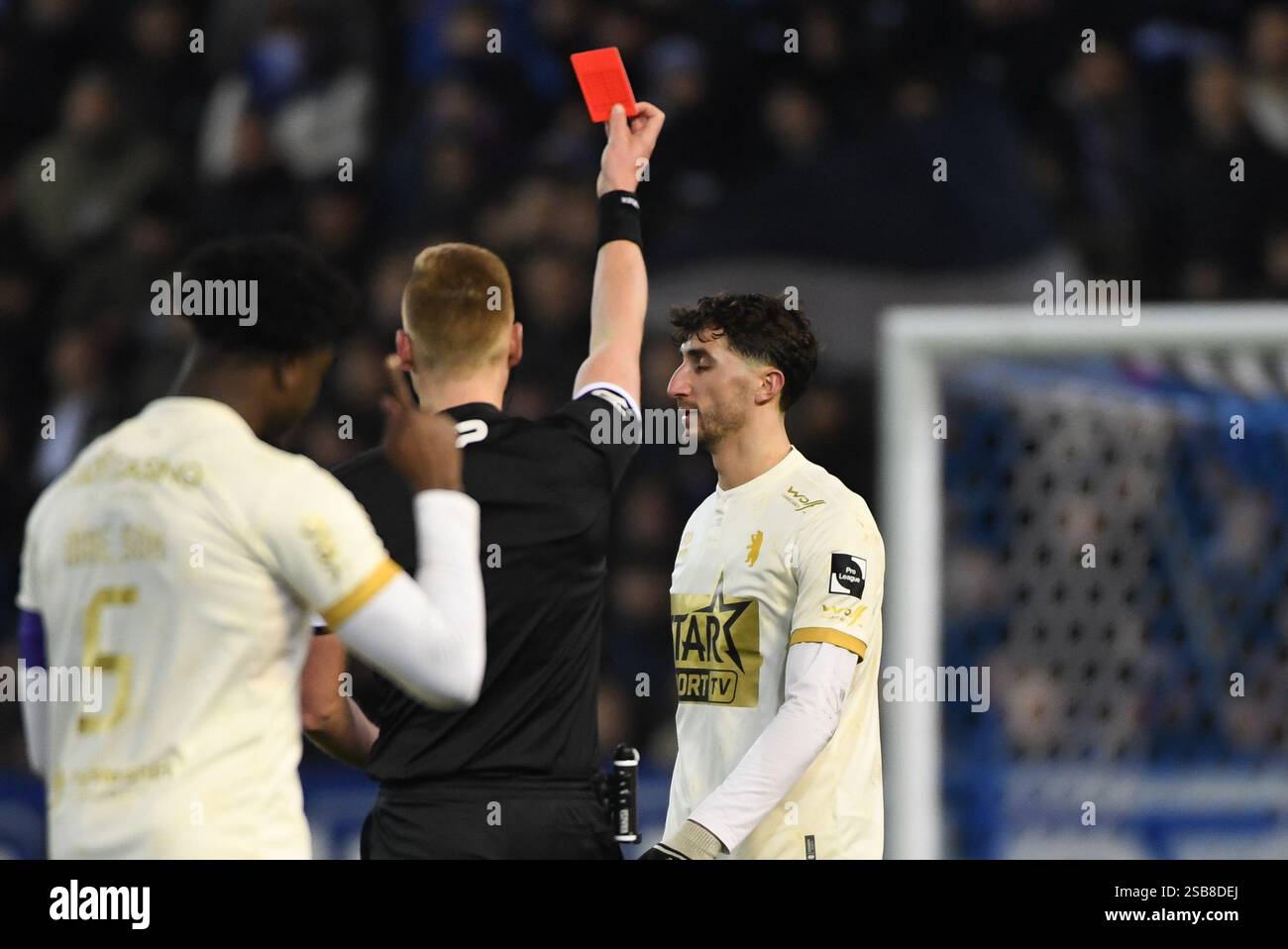 Genk, Belgium. 01st Feb, 2025. Beerschot's Welat Cagro receives a red ...