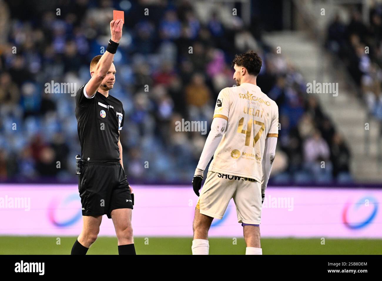 Genk, Belgium. 01st Feb, 2025. Beerschot's Welat Cagro receives a red ...