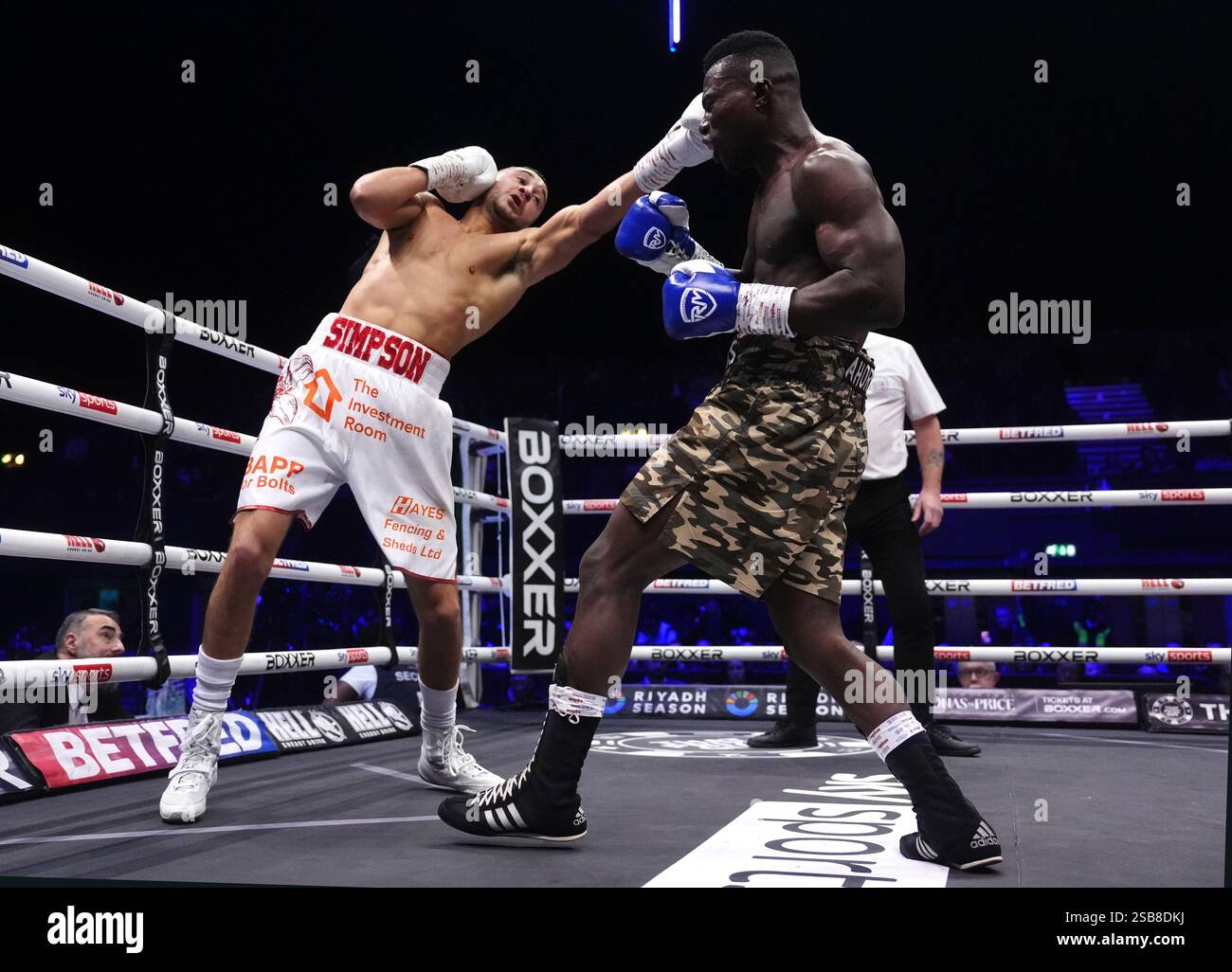 Callum Simpson (left) and Elvis Ahorgah in the Commonwealth Boxing ...