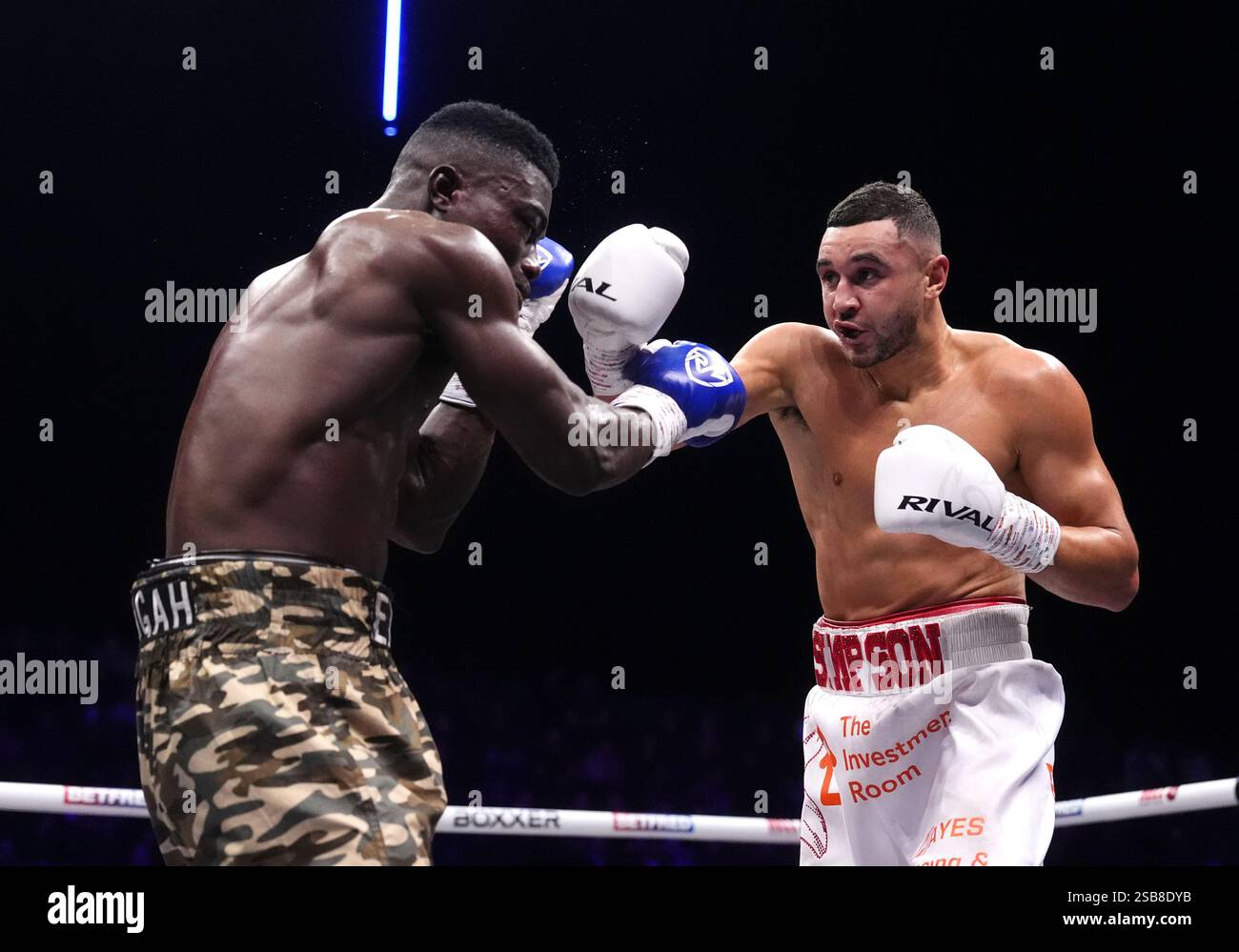 Callum Simpson (right) and Elvis Ahorgah in the Commonwealth Boxing ...