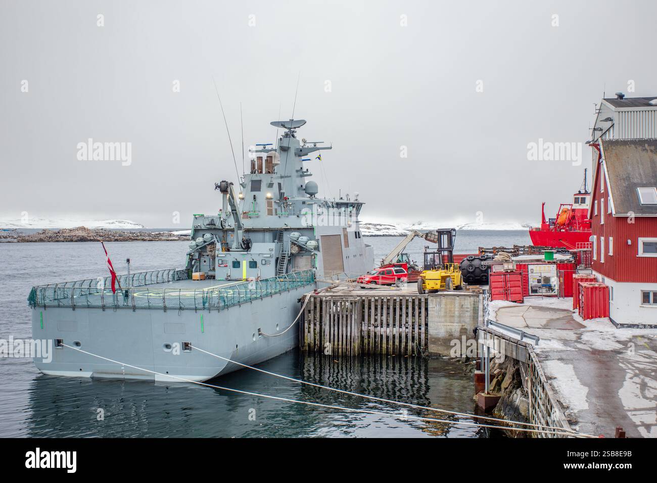 Danish nautical military force patrol war ship, docked at pier in Nuuk ...