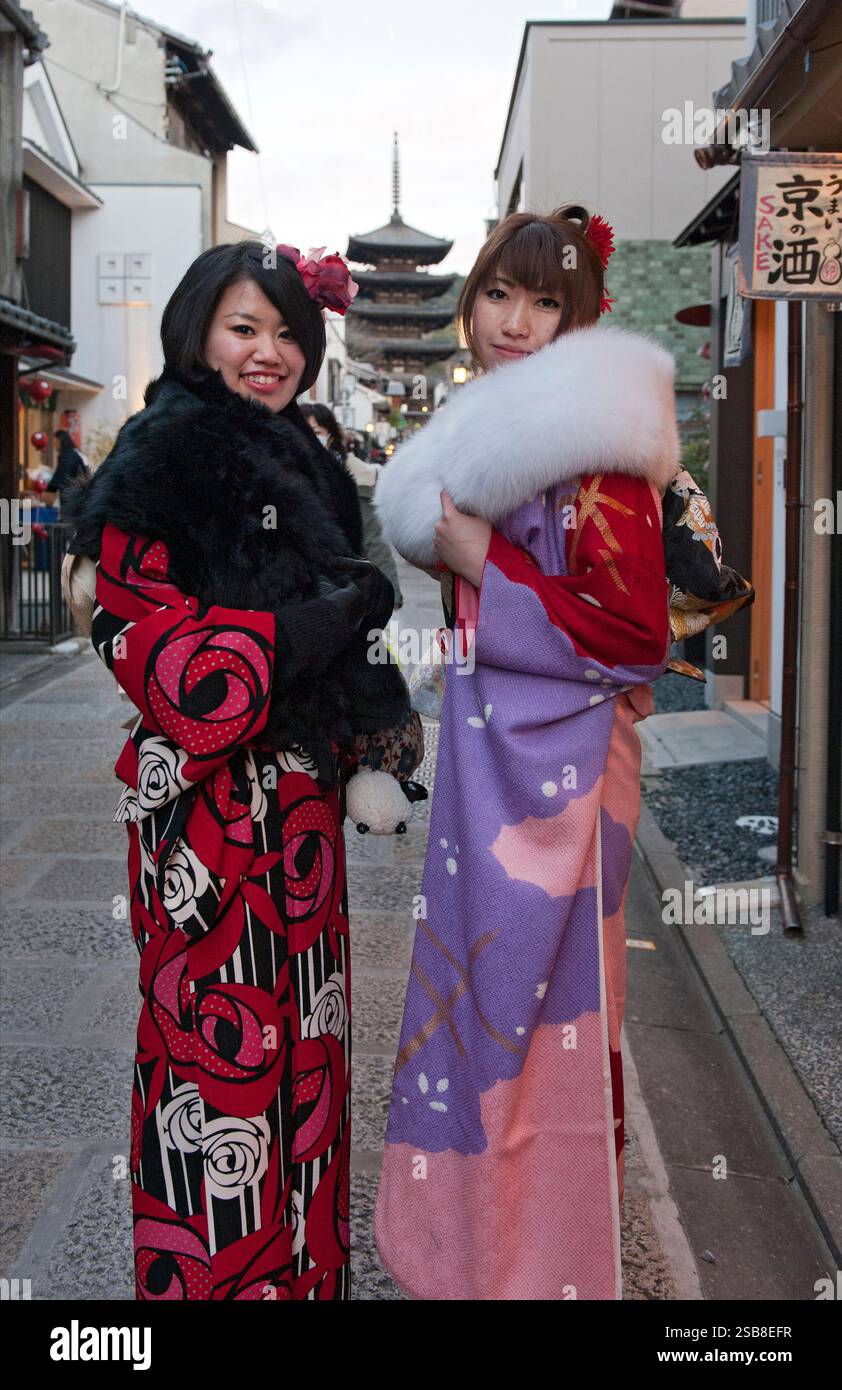 Female tourists dressed in colorful kimono yukata robes seen strolling ...
