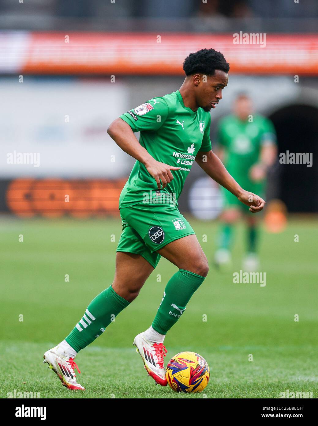 Newport, UK. 1st Feb 2025. #39, Leo Duru of Barrow AFC in action during ...