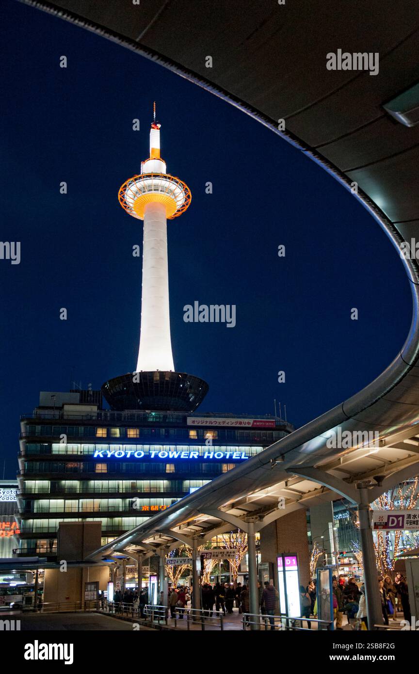 Evening view of illuminated Kyoto Tower from the bus stop, the iconic ...