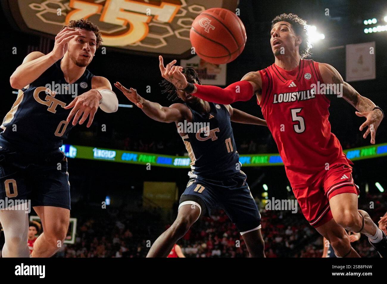 Louisville guard Terrence Edwards Jr. (5) vies for a loose ball against ...