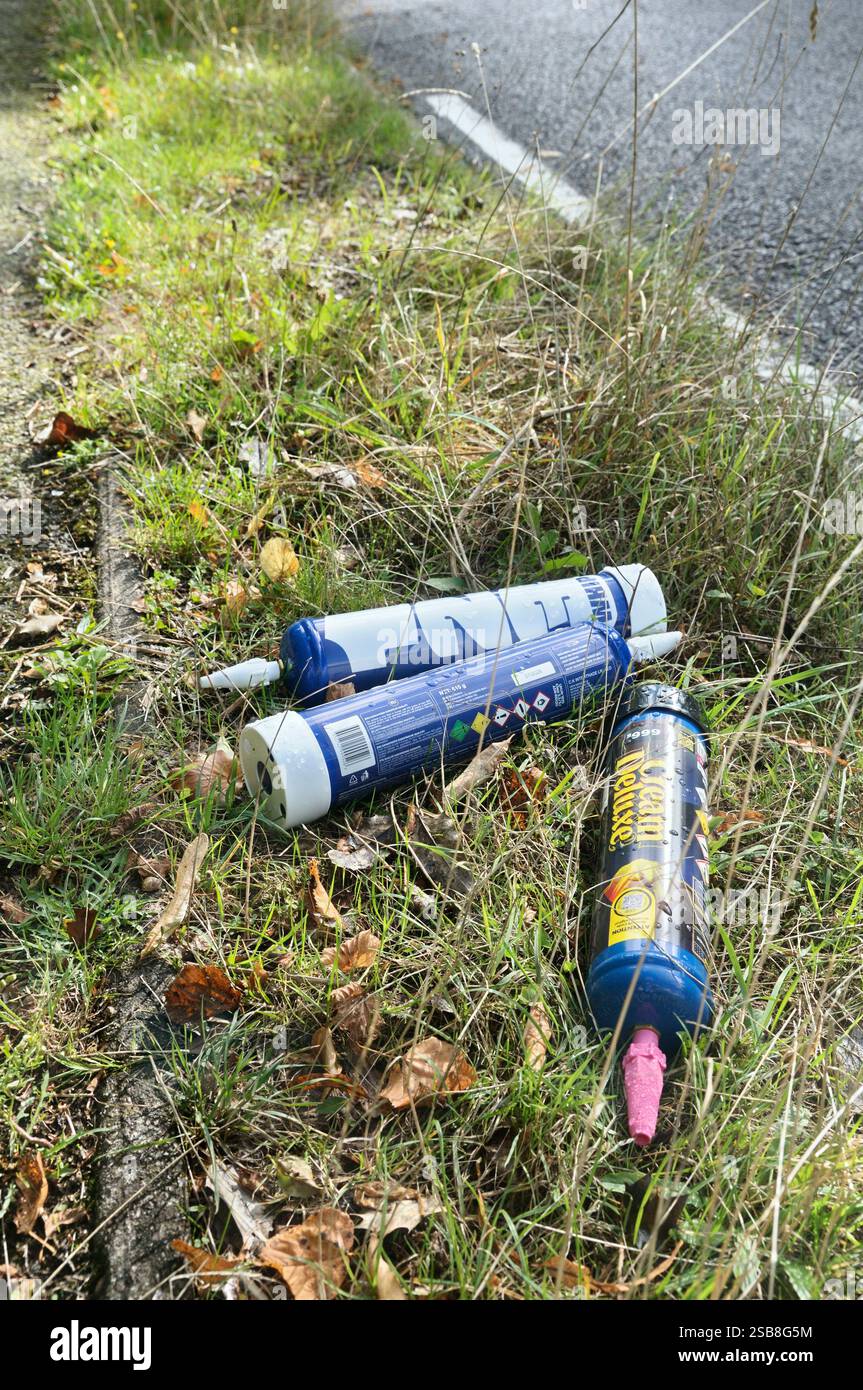 Used bottles of nitrous oxide N20, or laughing gas, littering an ...