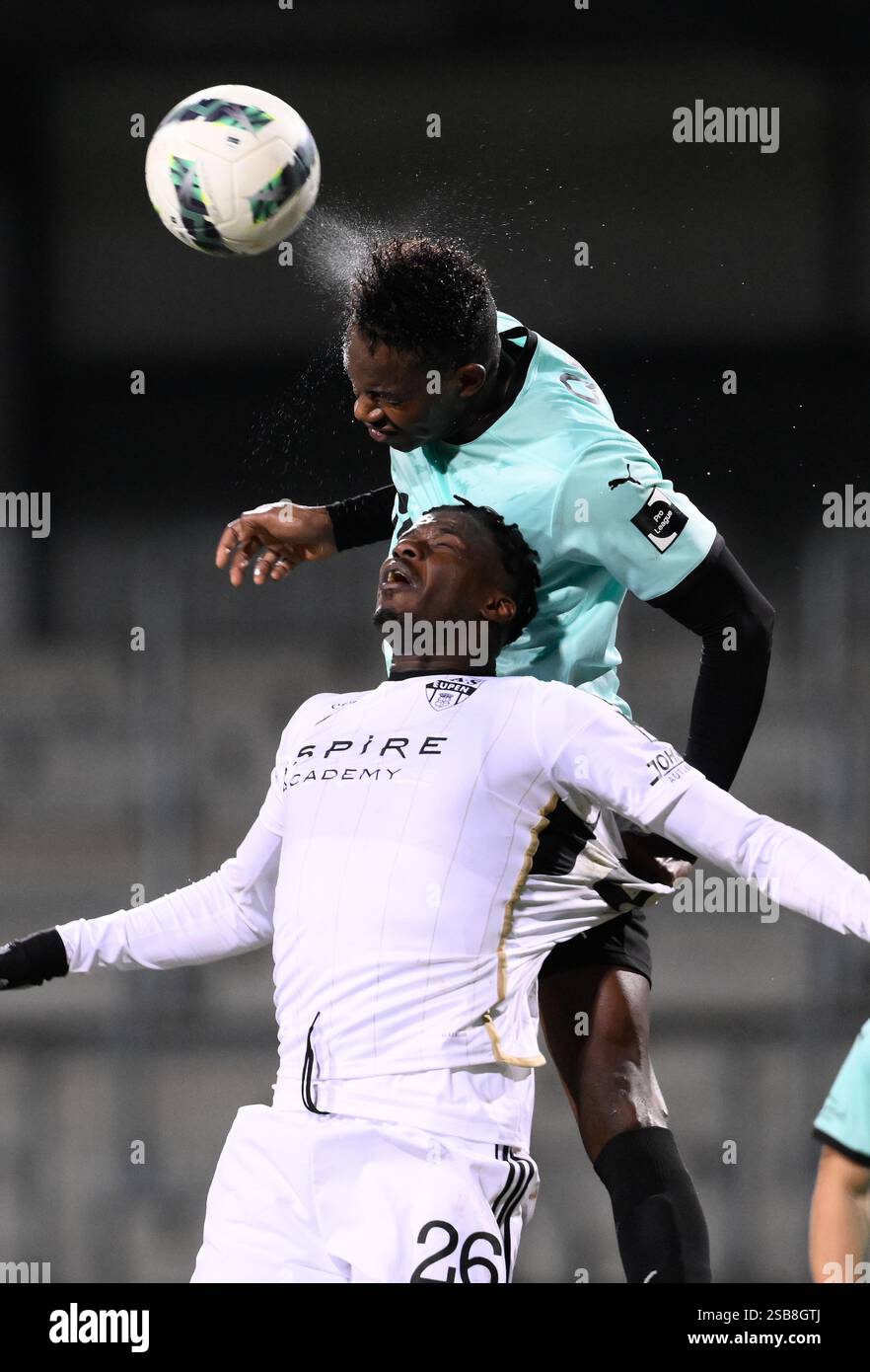 Eupen, Belgium. 01st Feb, 2025. Lommel's Ibrahima Kebe and Eupen's Pape Niang fight for the ball ...