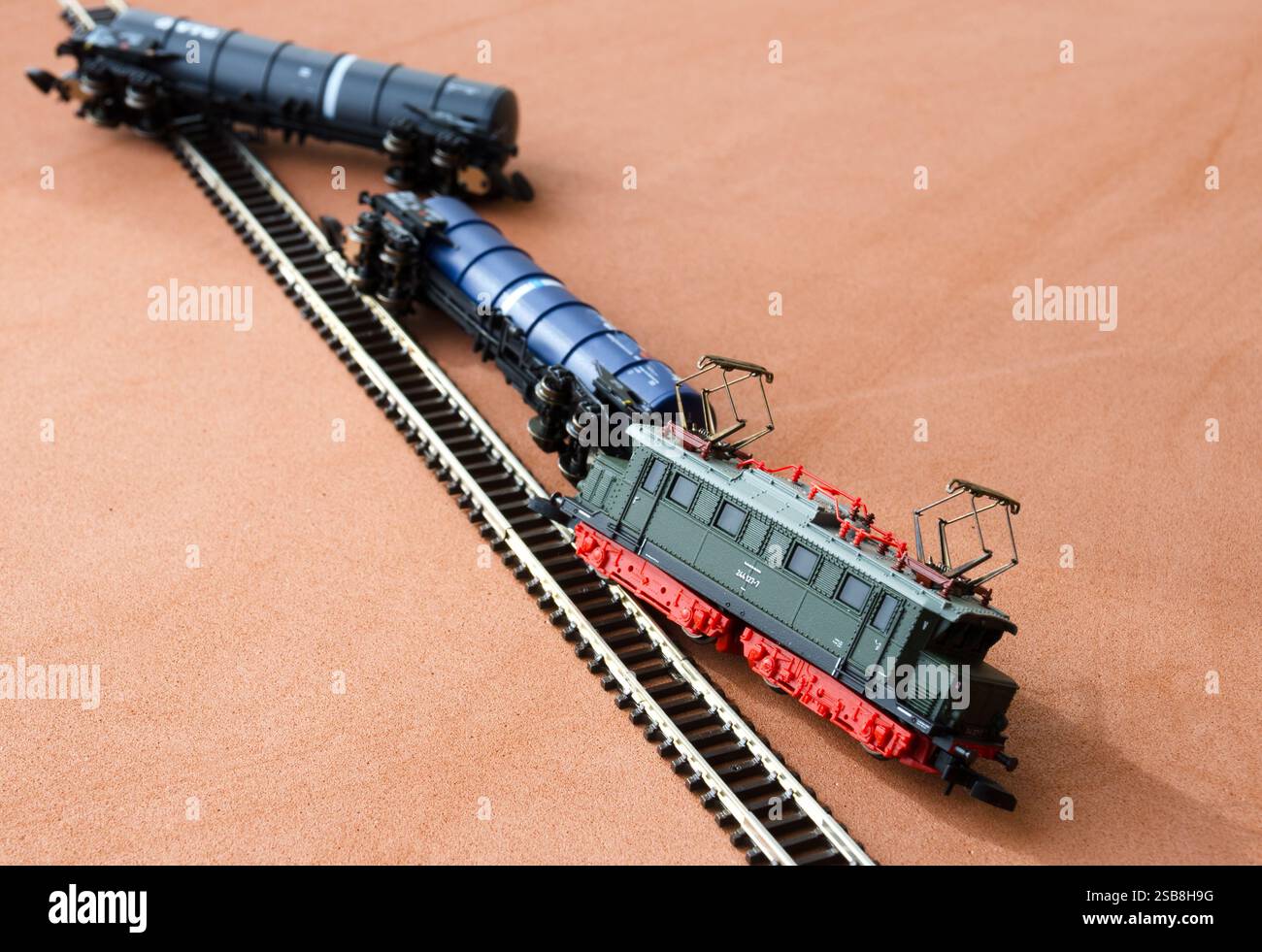 Crash of fuel tanks. Toy railroad with selective focus effect. Model of ...